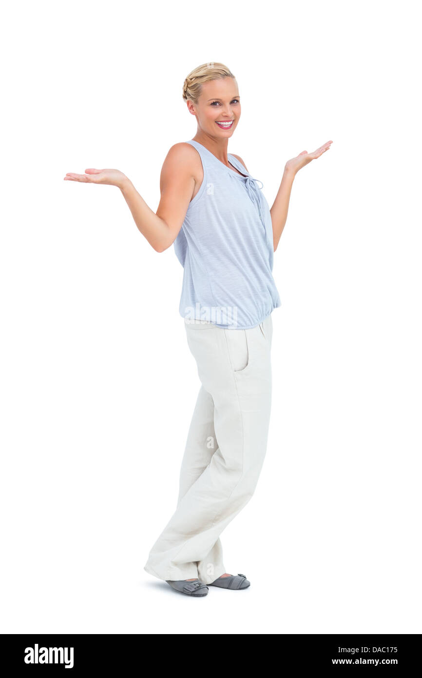 Happy woman standing with hands up Stock Photo - Alamy