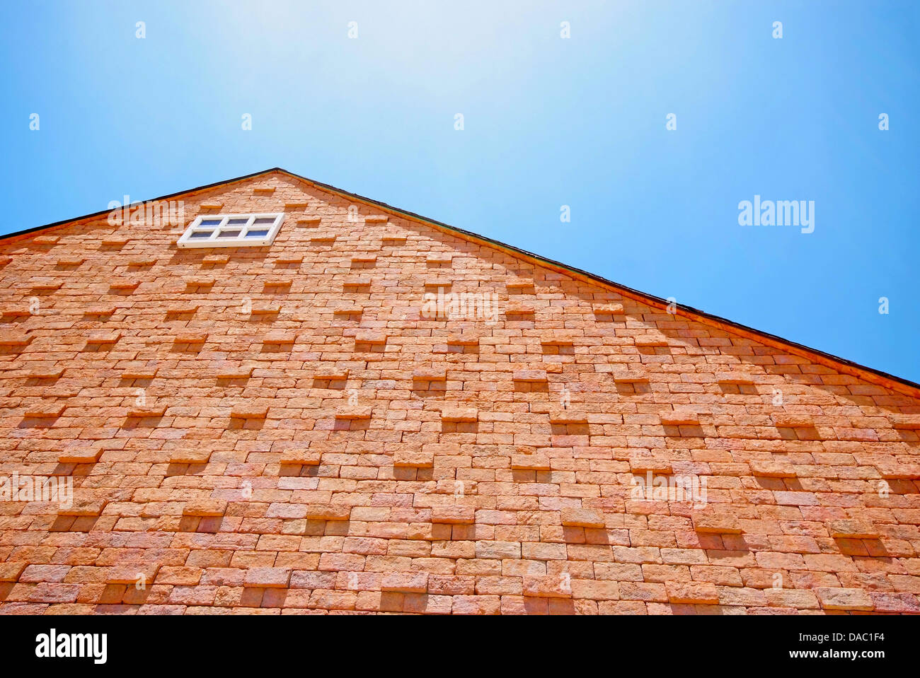 White window on the brick building and blue sky Stock Photo - Alamy