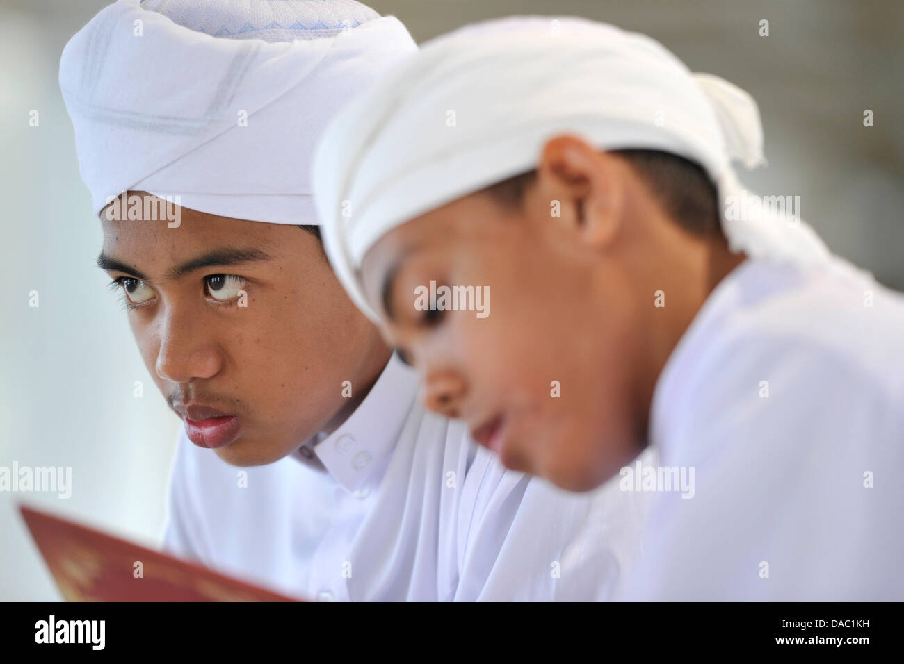 Putrajaya, Malaysia. 10th July, 2013. Malaysian Muslim boys recite the ...
