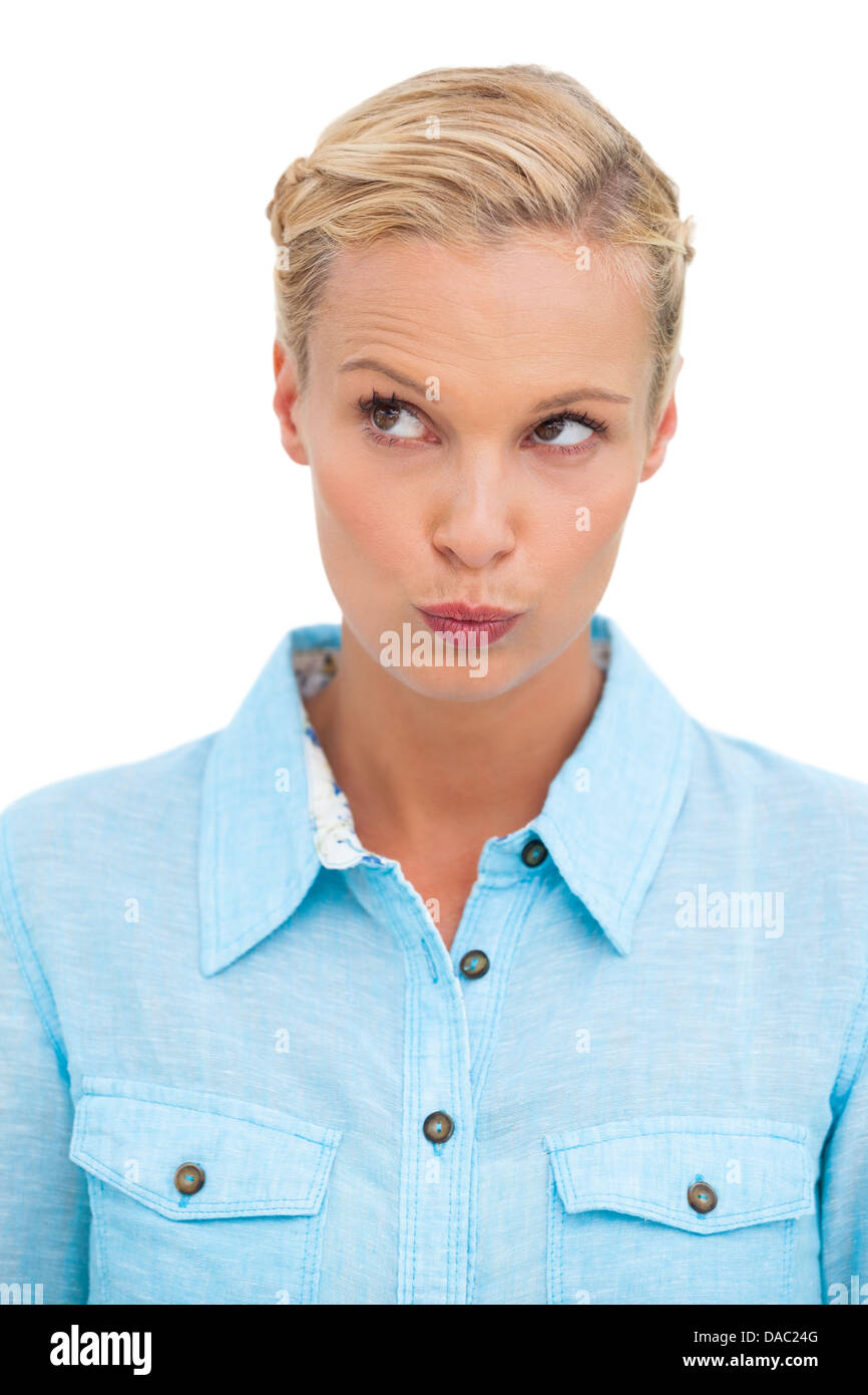 Serious blonde looking up Stock Photo - Alamy