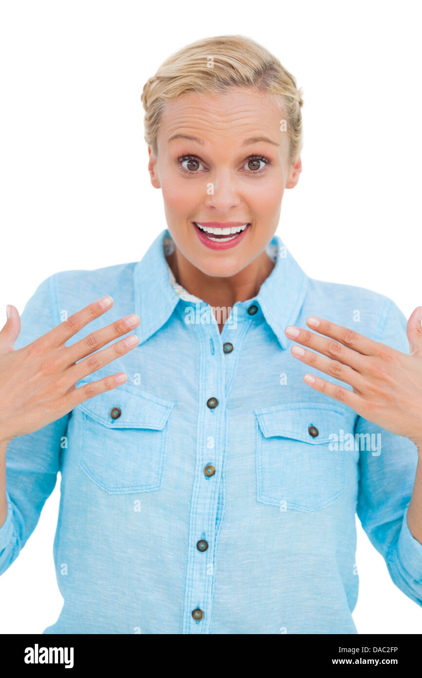 Astonished blonde woman looking at camera Stock Photo - Alamy