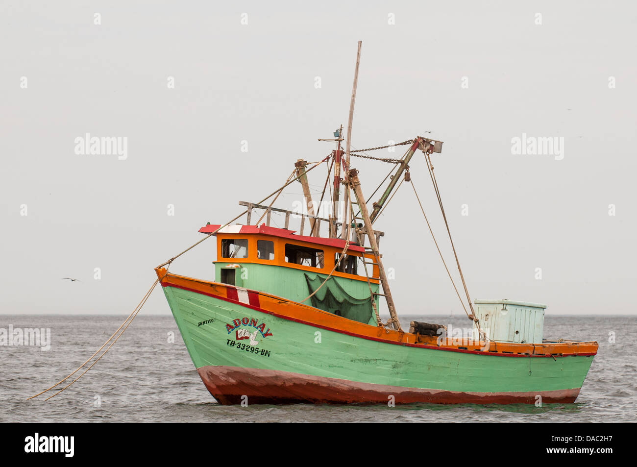 Wooden sardine fishing boat at anchor anchored in Cabo Blanco, Peru ...