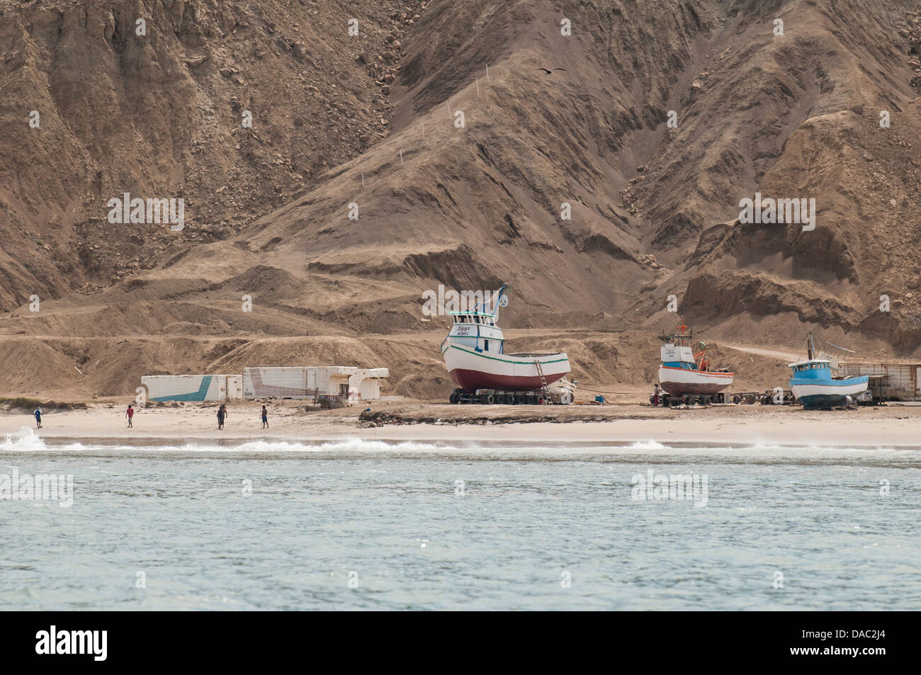 Sardine fishing boats on line beach at Cabo Blanco, Peru Stock Photo ...
