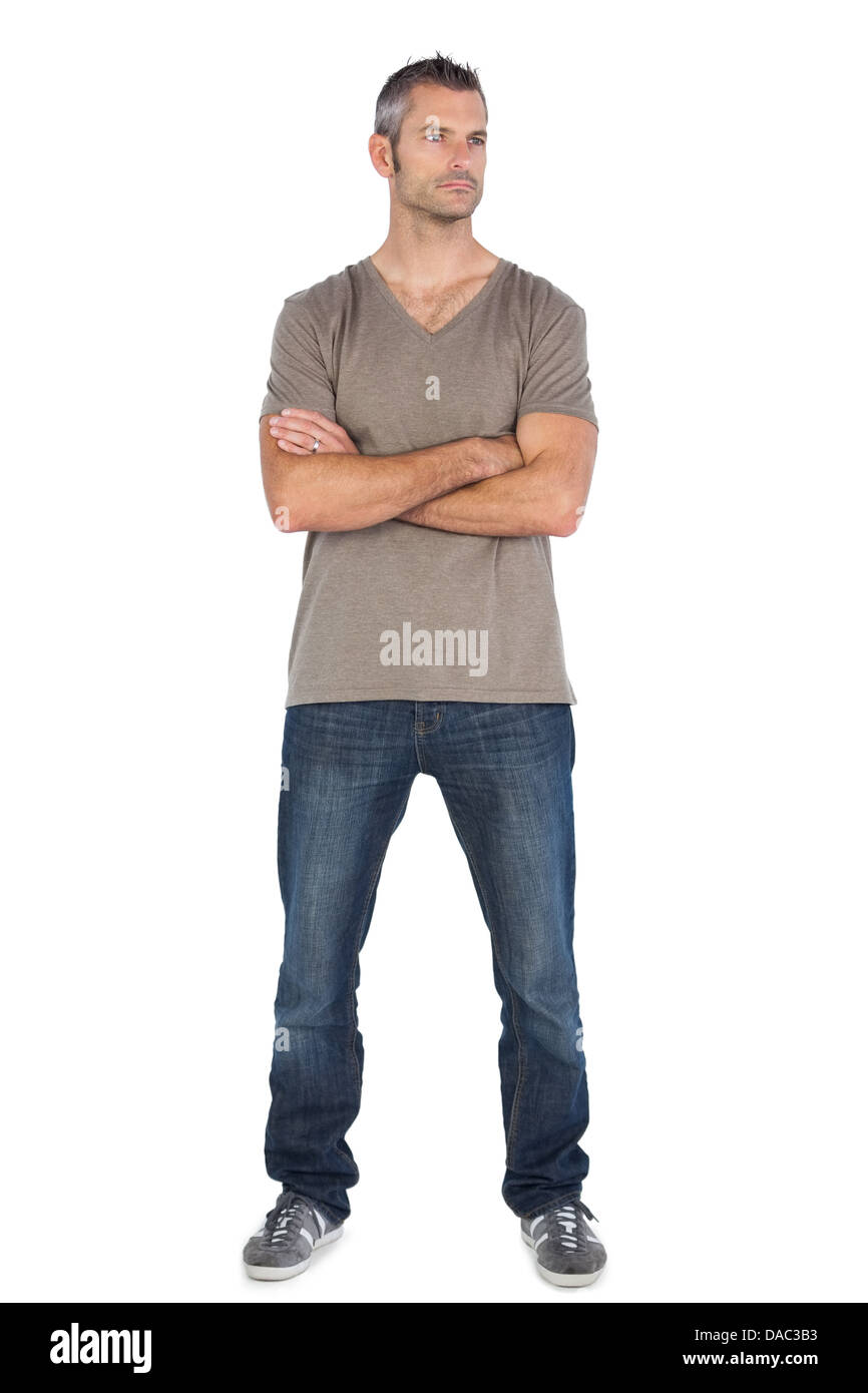 A man standing with arms crossed Stock Photo - Alamy