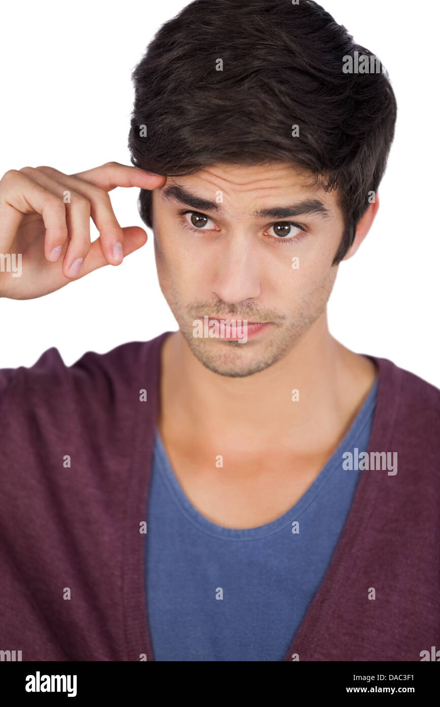 Young man with hand on forehead Stock Photo - Alamy
