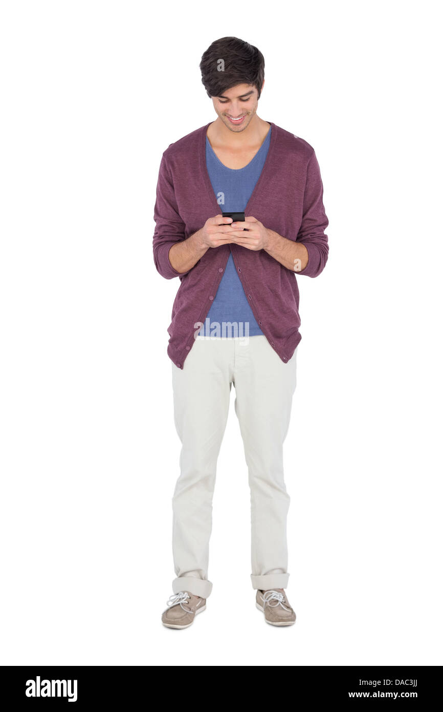 Smiling man looking at his mobile phone Stock Photo - Alamy