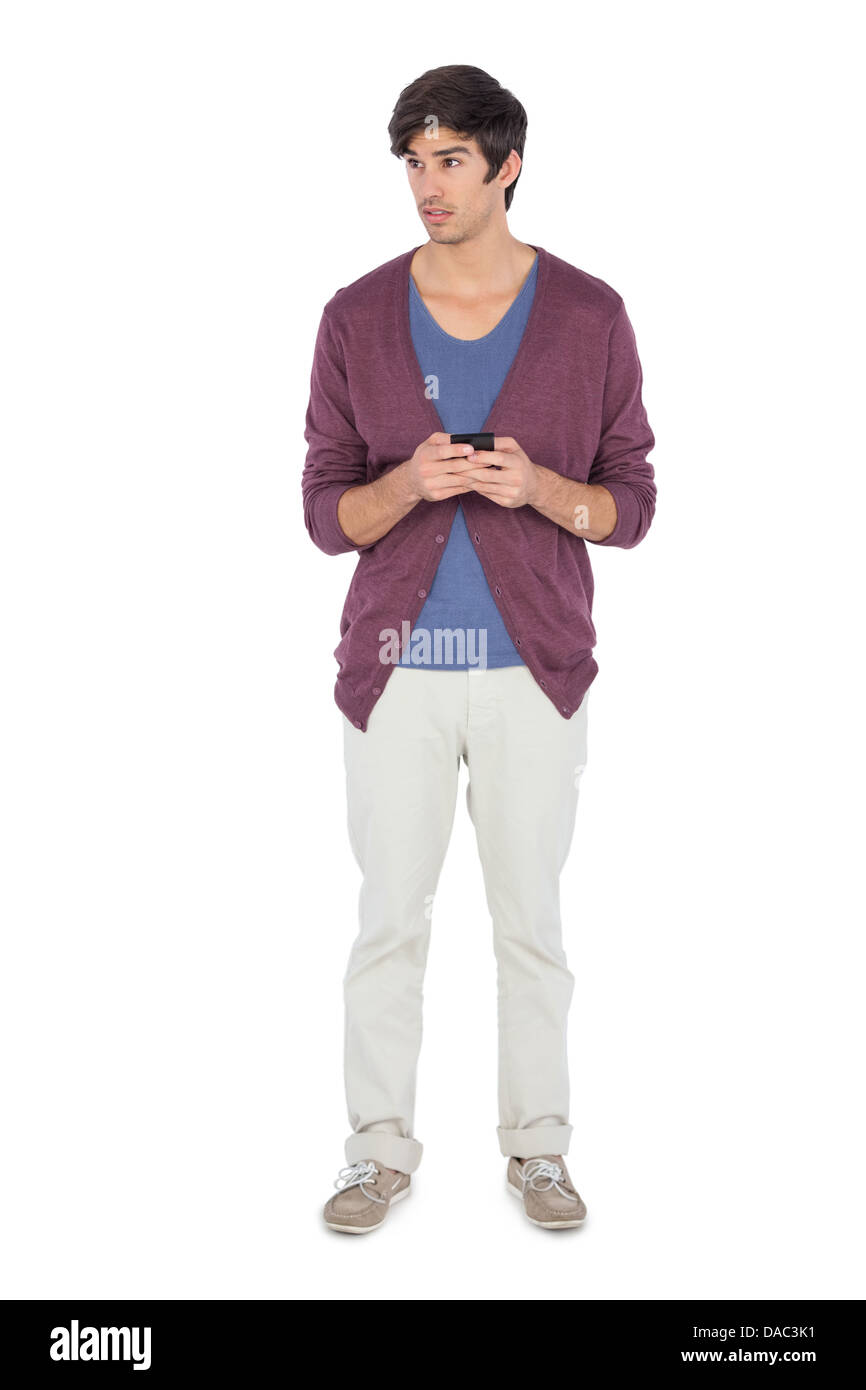 Man standing using phone Cut Out Stock Images & Pictures - Alamy