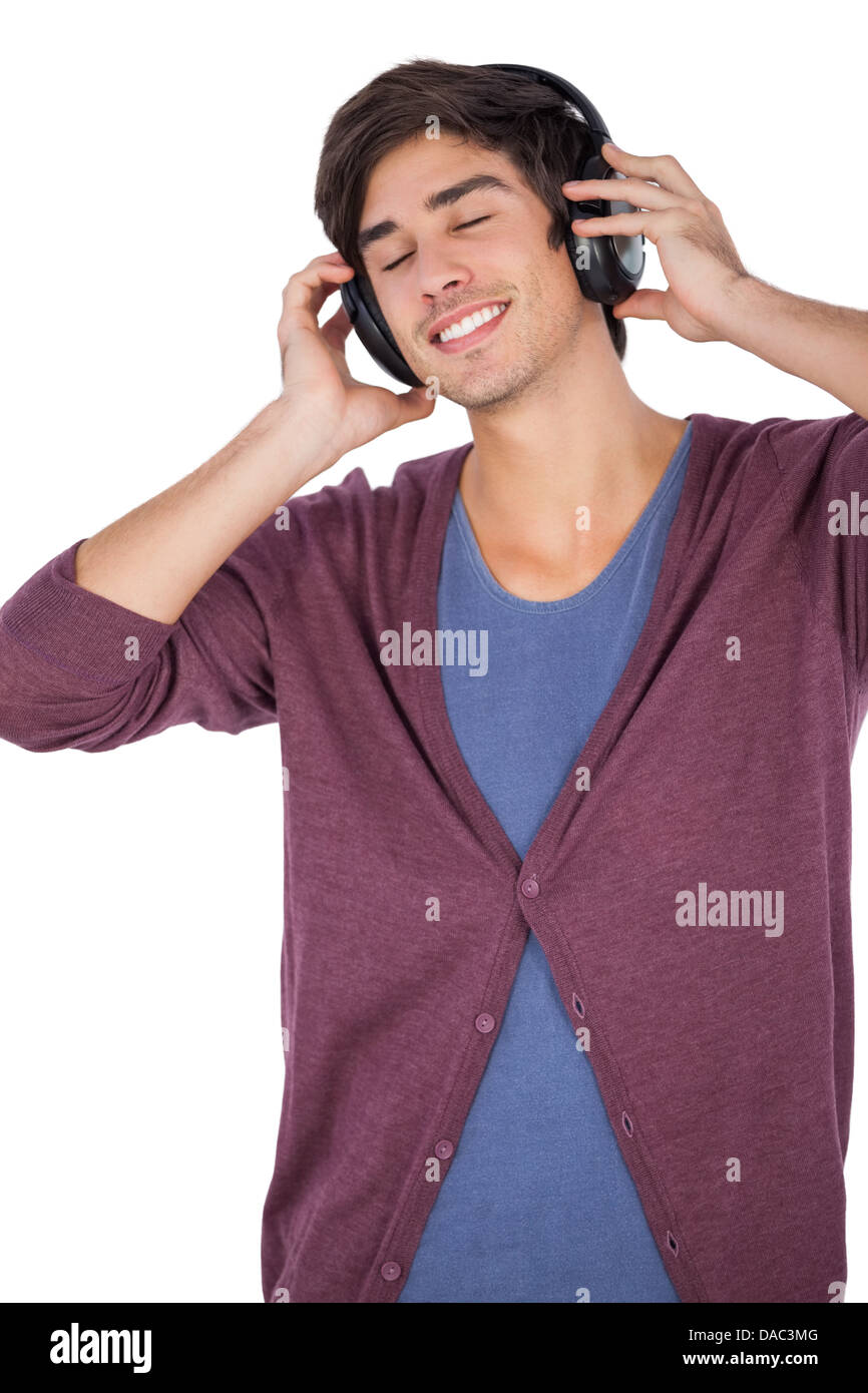 Young man listening to music Stock Photo - Alamy