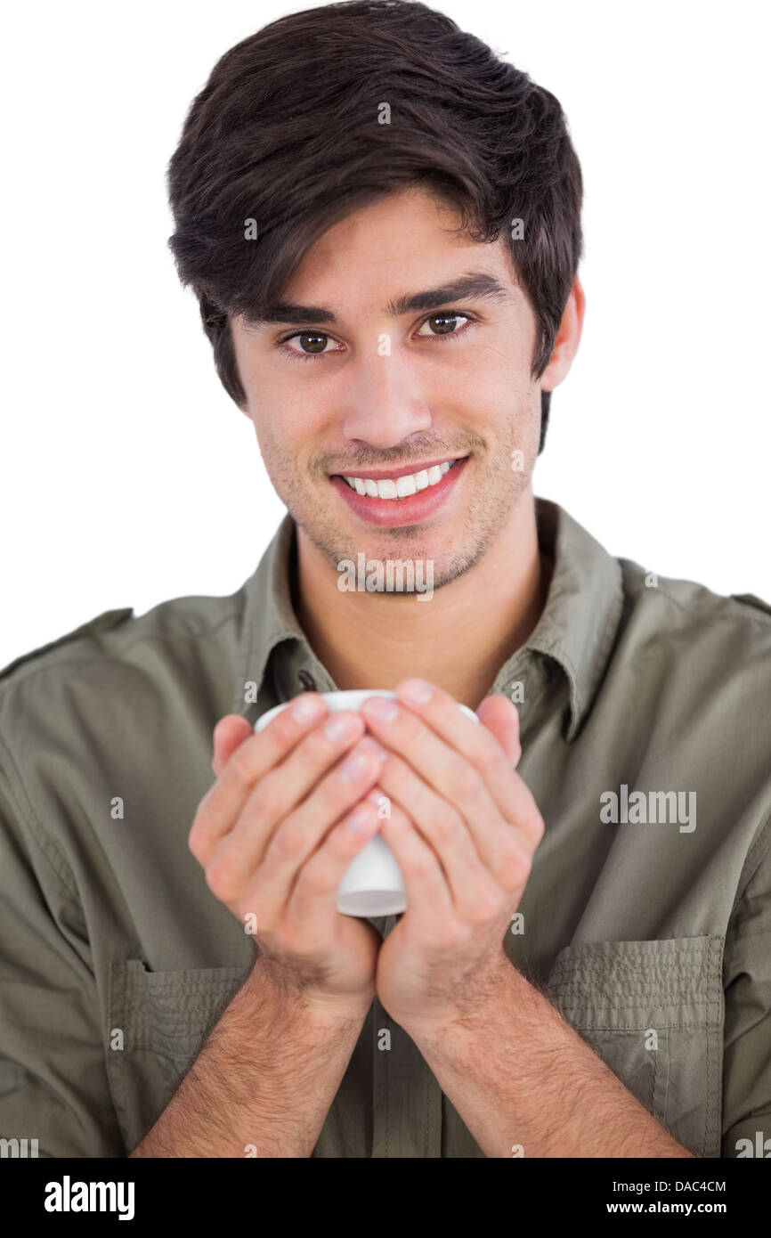 Smiling man having a coffee Stock Photo - Alamy