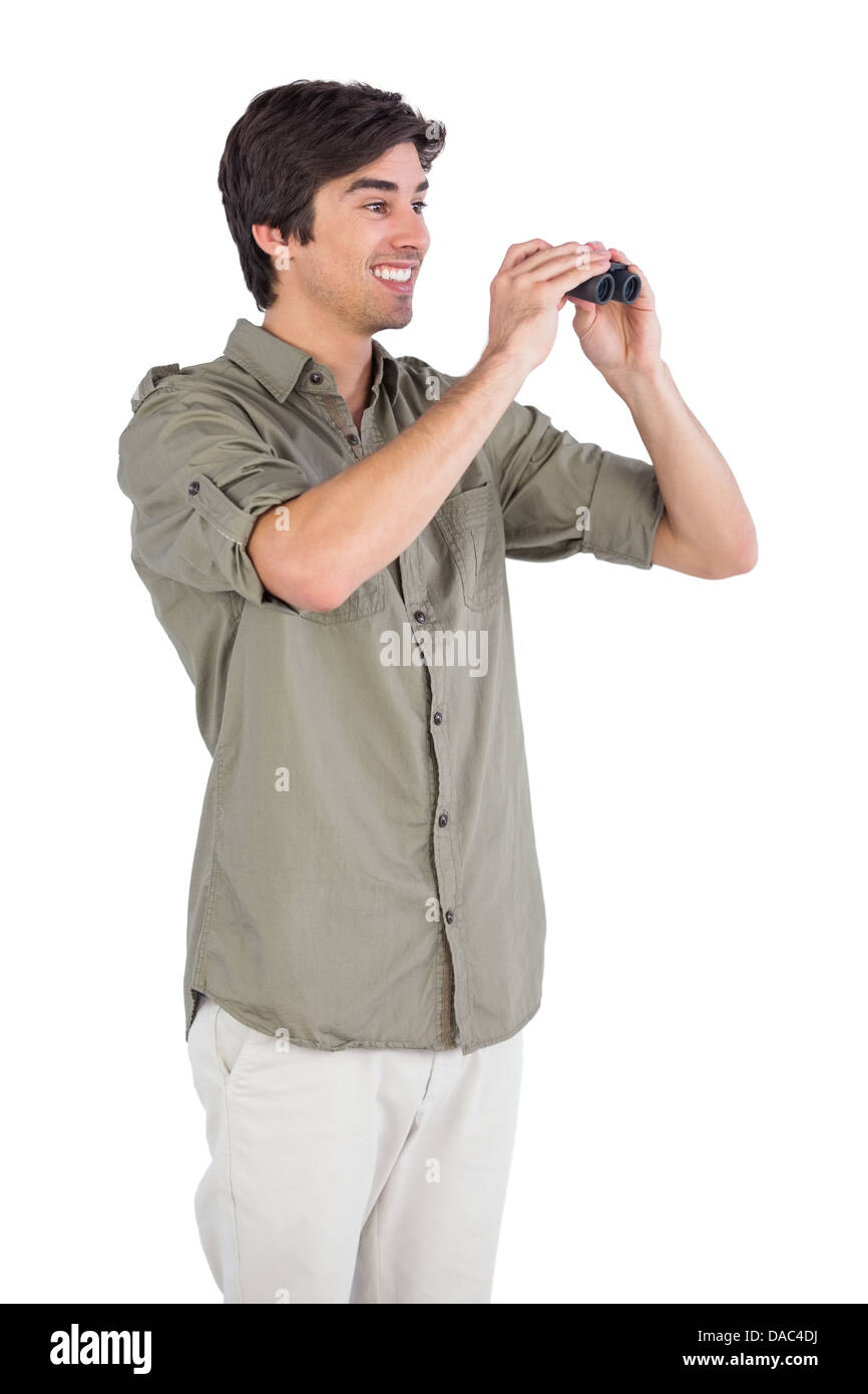 Smiling man using binoculars Stock Photo - Alamy