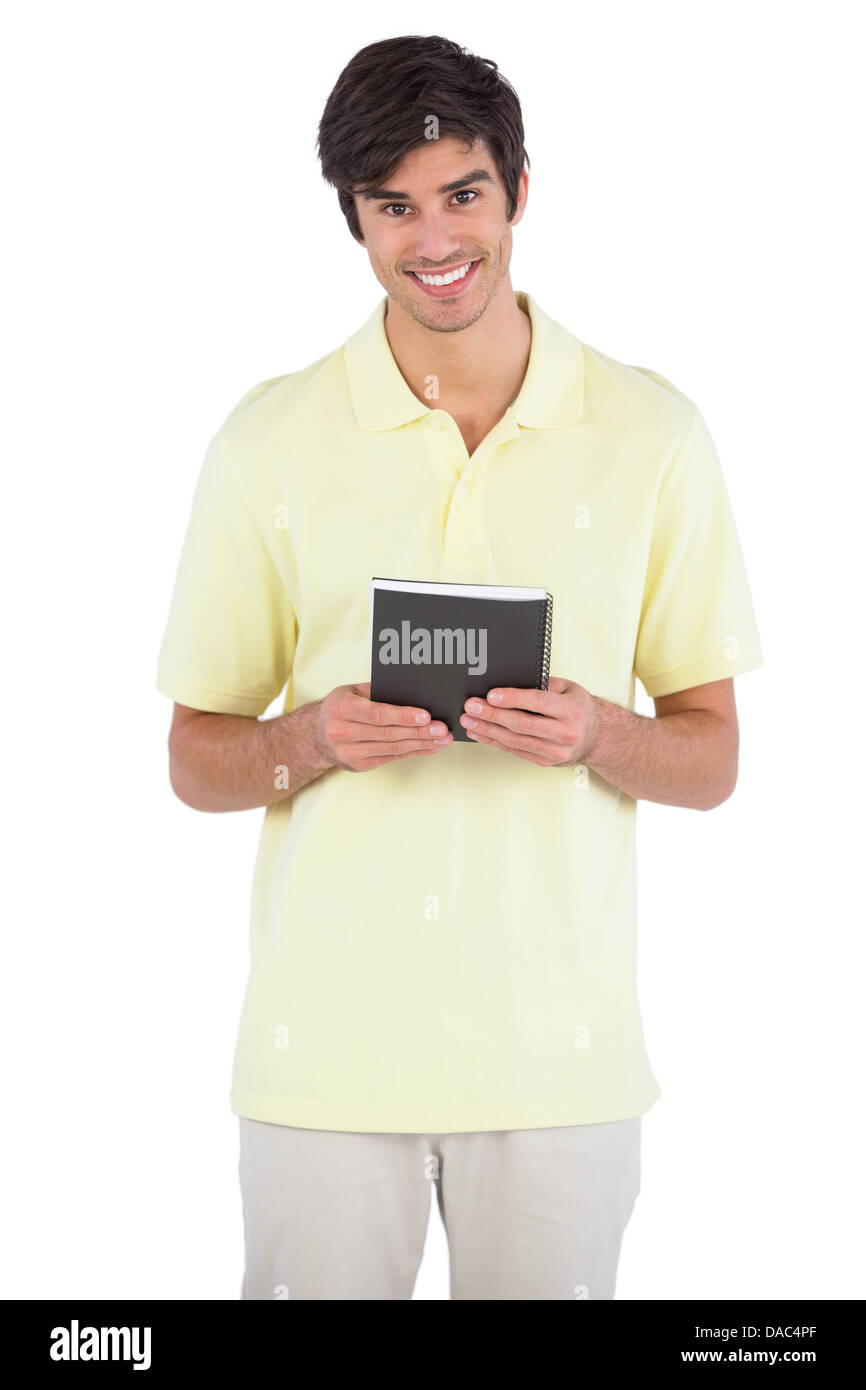 Smiling man holding black notebook Stock Photo - Alamy