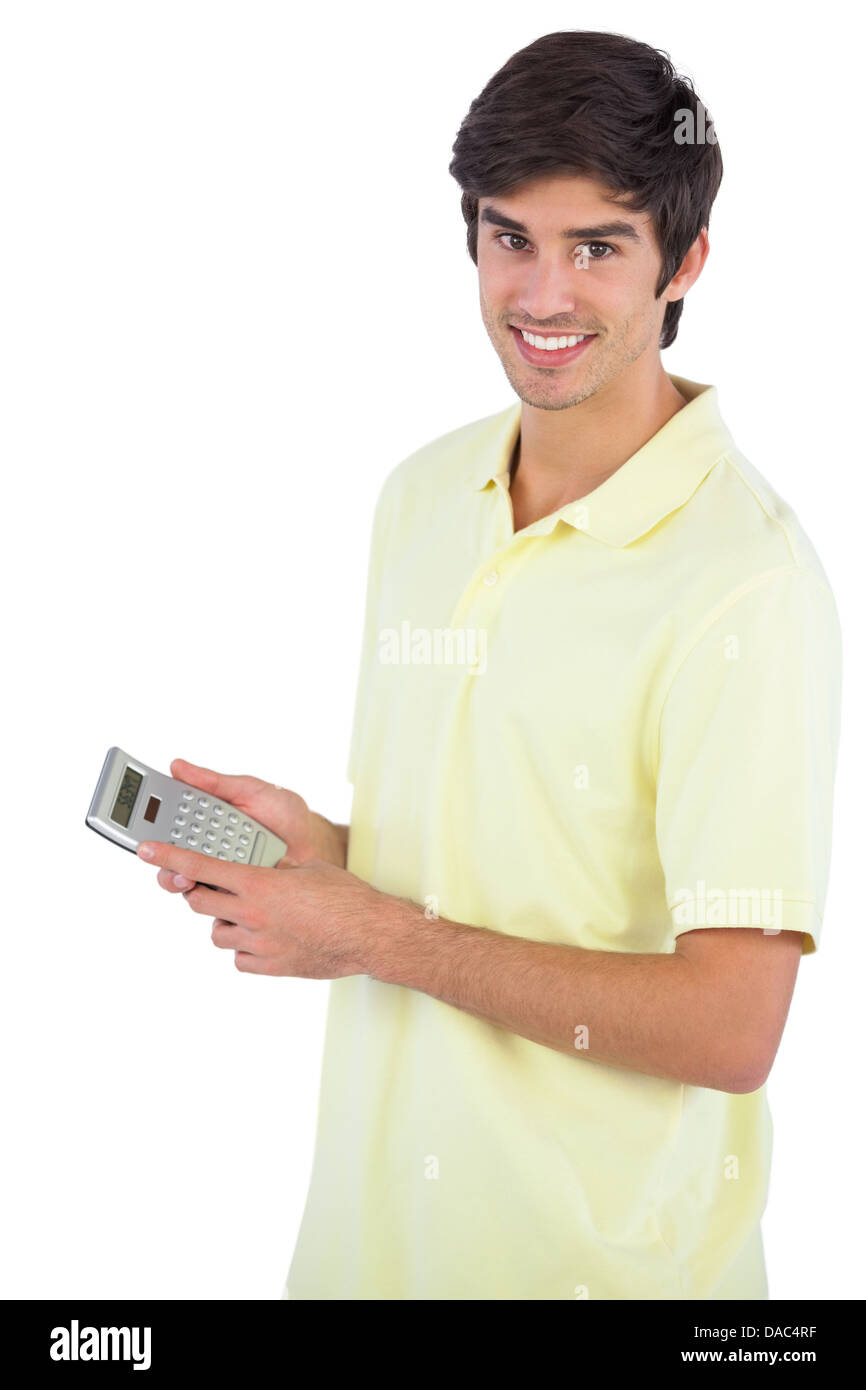 Smiling man using calculator Stock Photo - Alamy