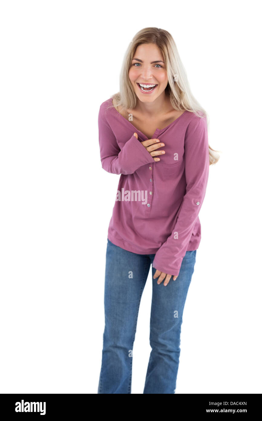 Young woman laughing while looking at the camera Stock Photo - Alamy