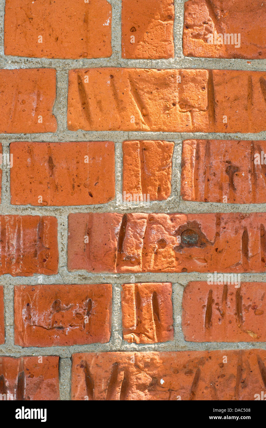 Notches on a brick wall Stock Photo - Alamy