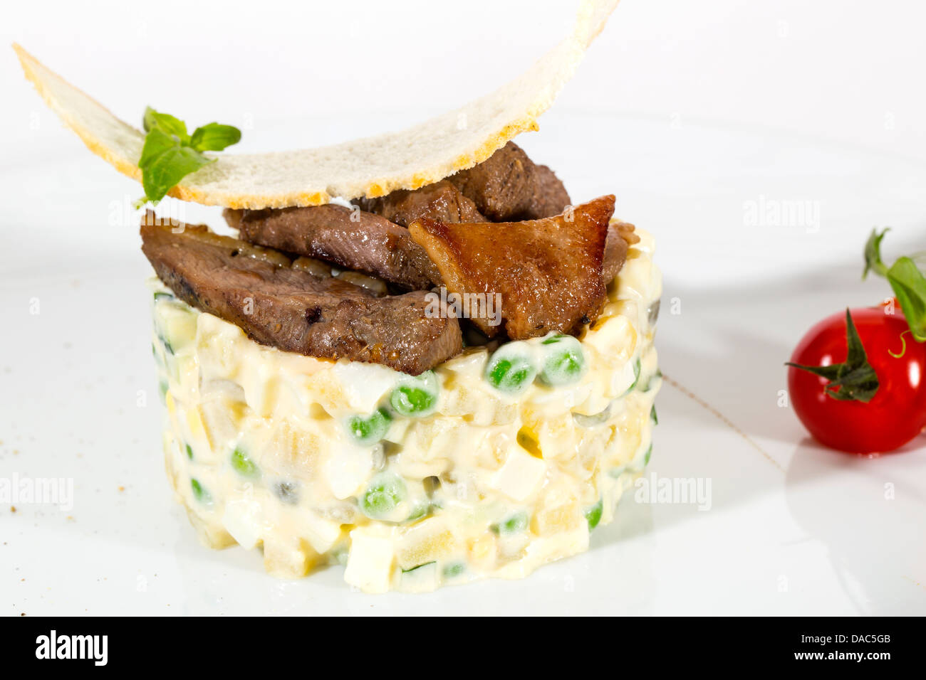 salad with meat on a table in a restaurant Stock Photo - Alamy
