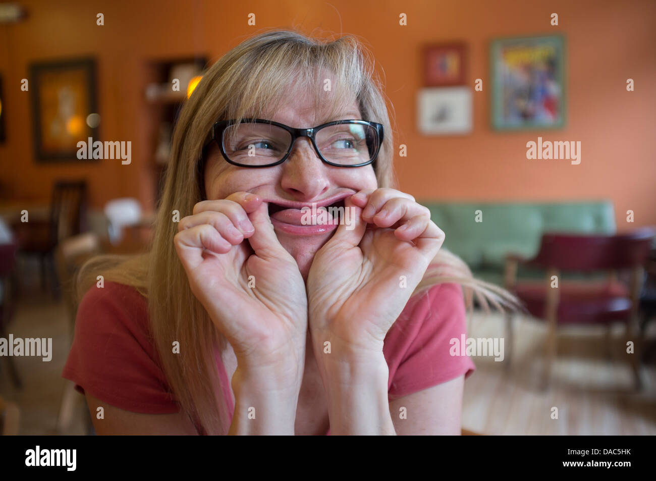 Woman making silly face Stock Photo - Alamy