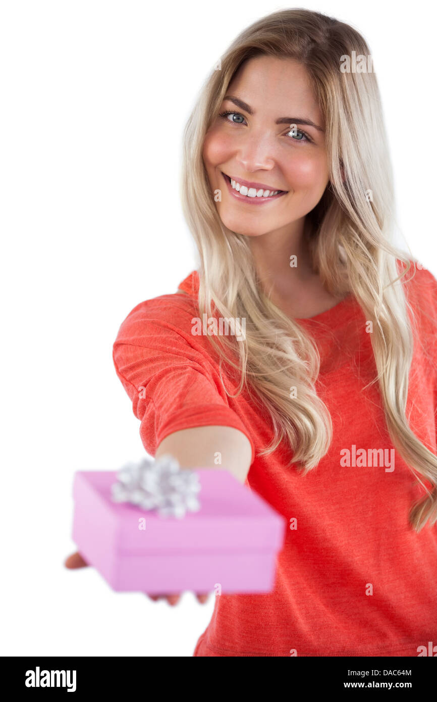 Blonde woman offering a present Stock Photo - Alamy