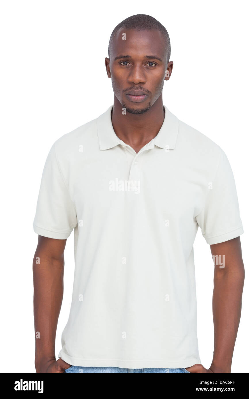 Serious man standing and looking at the camera Stock Photo - Alamy