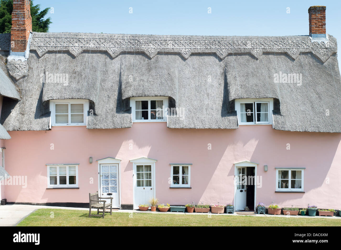 Pink house with thatched roof hi-res stock photography and images - Alamy