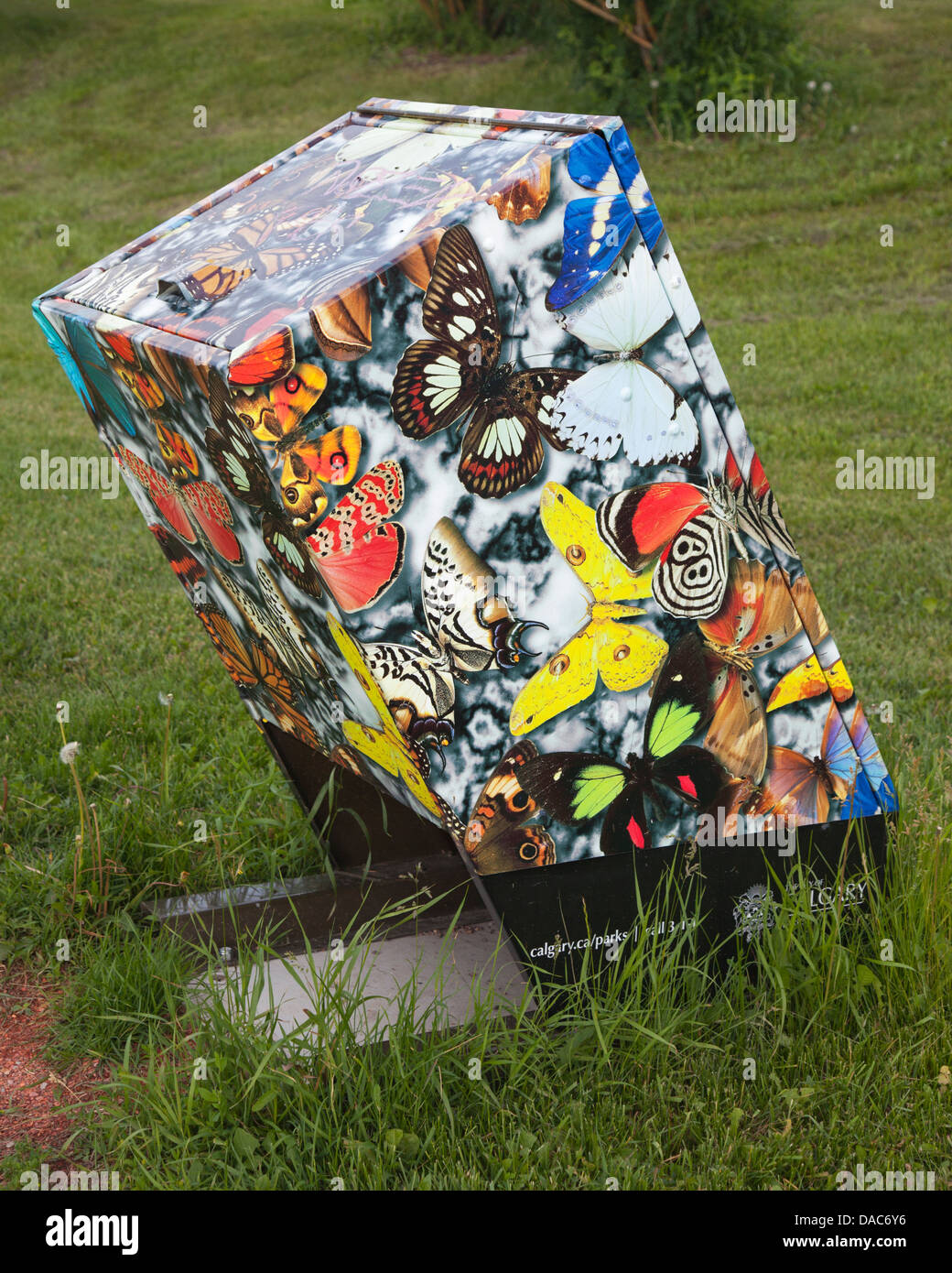 Garbage can decorated with butterflies Stock Photo - Alamy