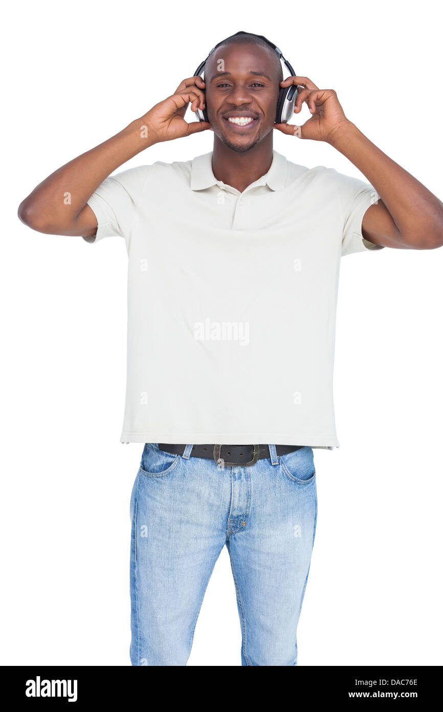Smiling man using headphones Stock Photo - Alamy