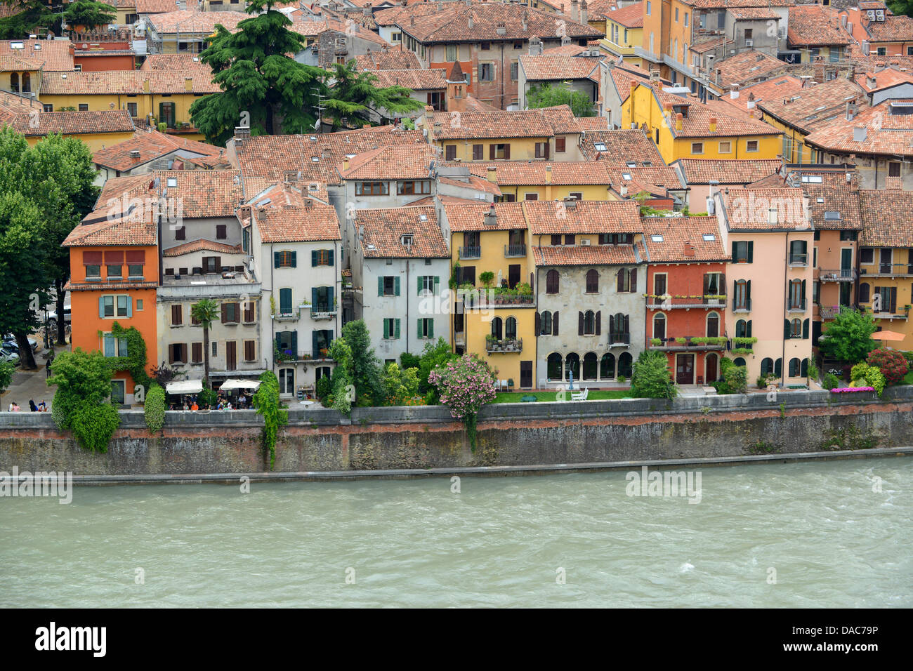 Verona Italy riverside houses and restaurants Stock Photo - Alamy