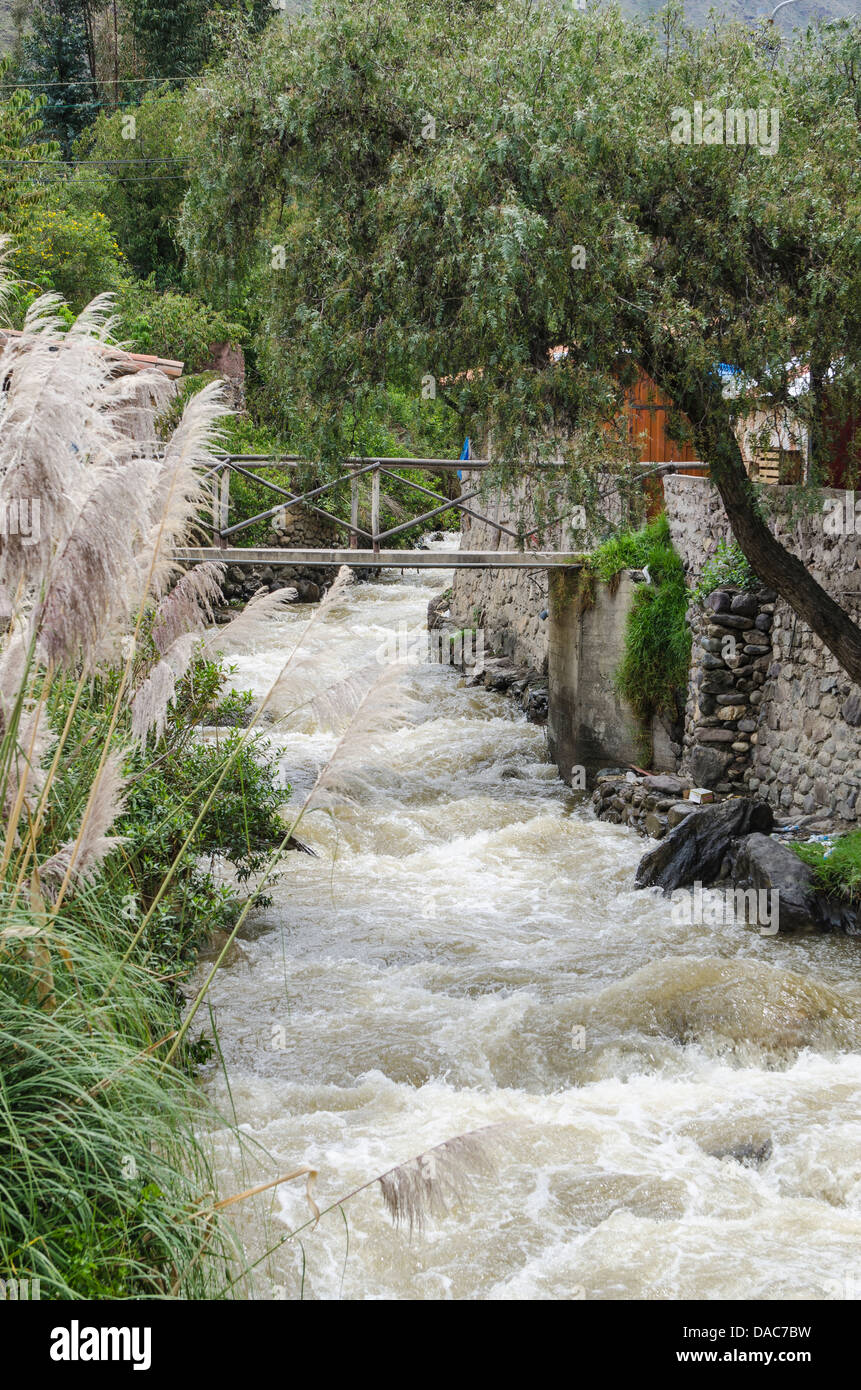 The Vilcanota River beside the Ollanta Train station in Ollantaytambo ...