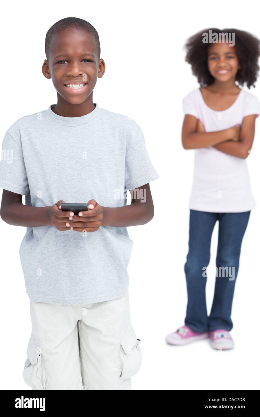 Smiling boy using mobile phone Stock Photo - Alamy