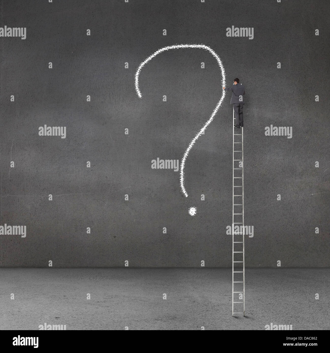 Businessman writing a question mark Stock Photo - Alamy