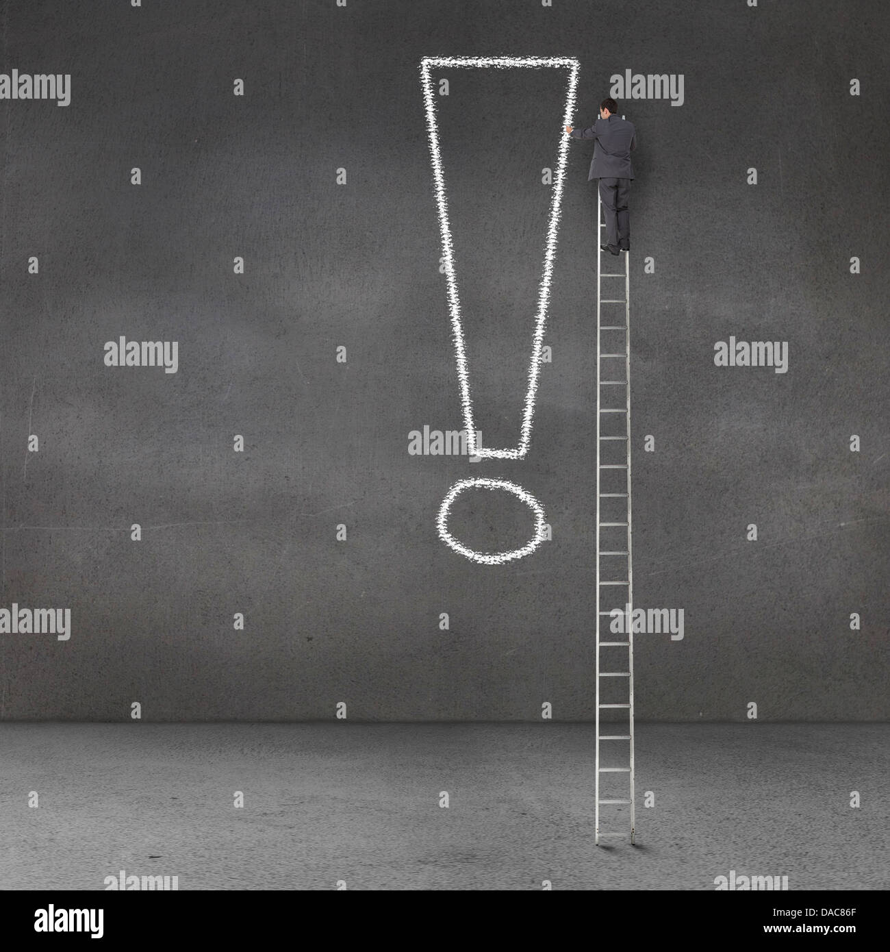 Businessman writing an exclamation mark Stock Photo - Alamy