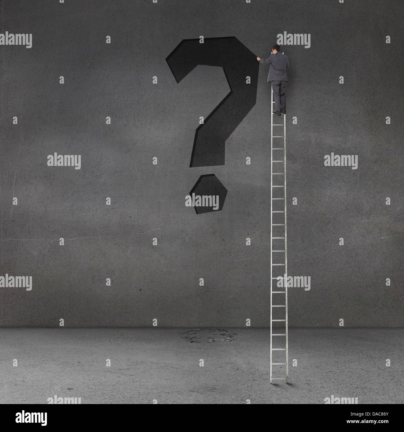 Businessman writing a black question mark Stock Photo - Alamy