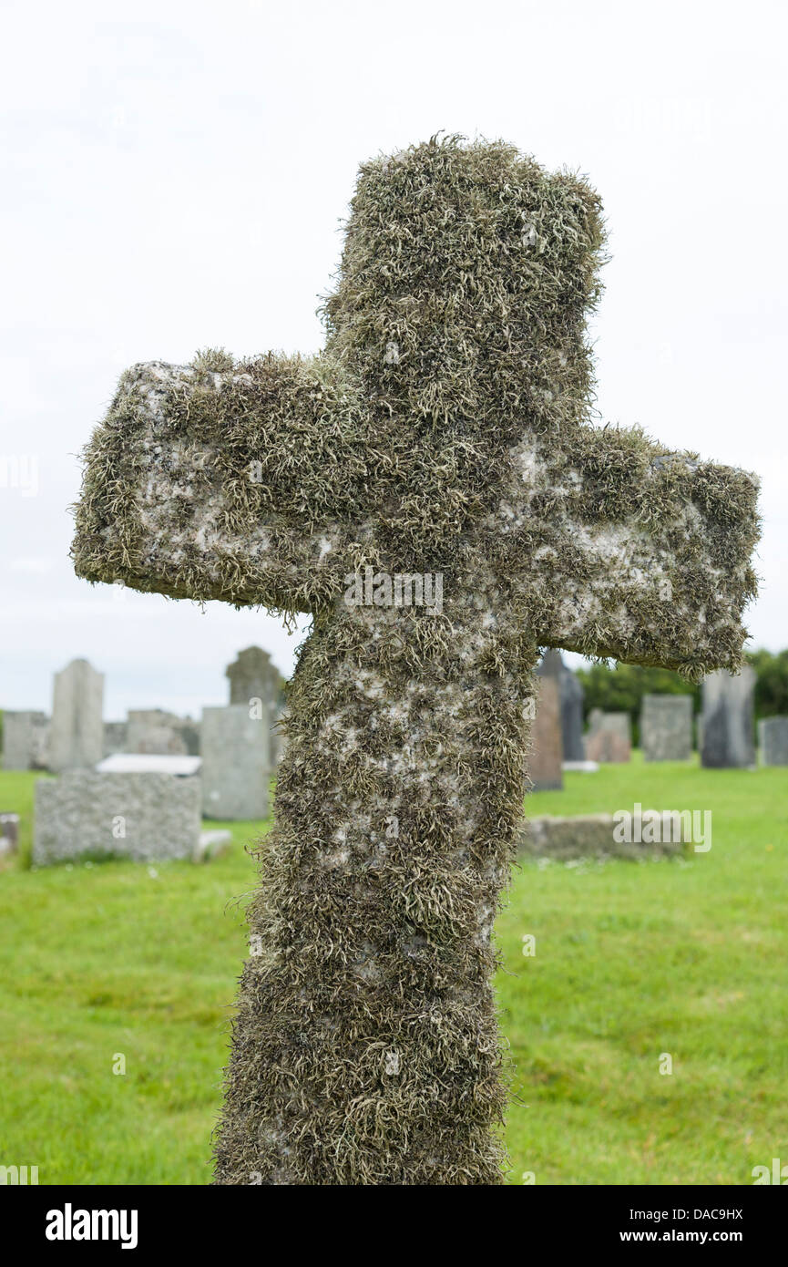 A gravestone cross covered in moss at St Eval Church North Cornwall UK ...