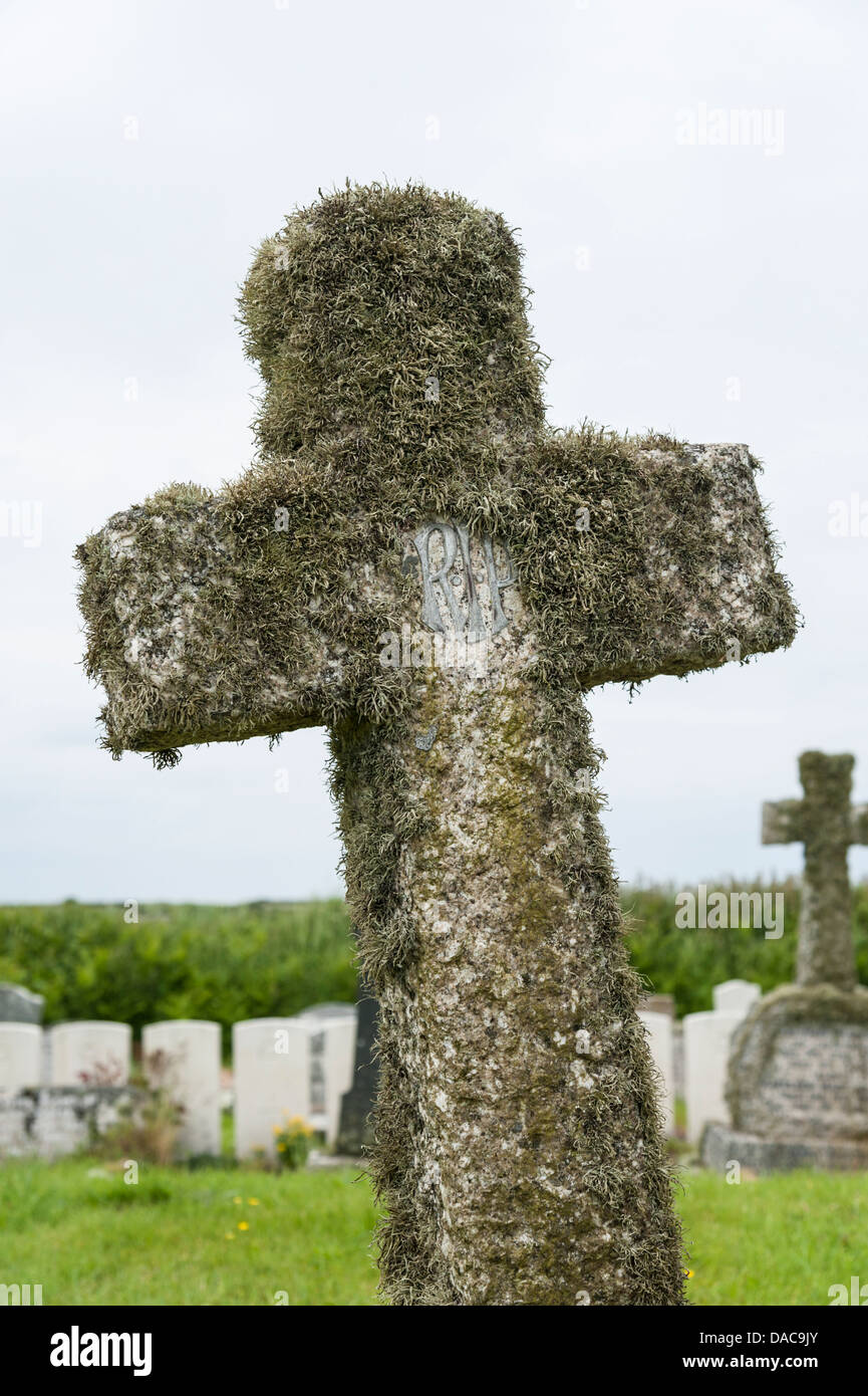 A gravestone cross covered in moss at St Eval Church North Cornwall UK ...