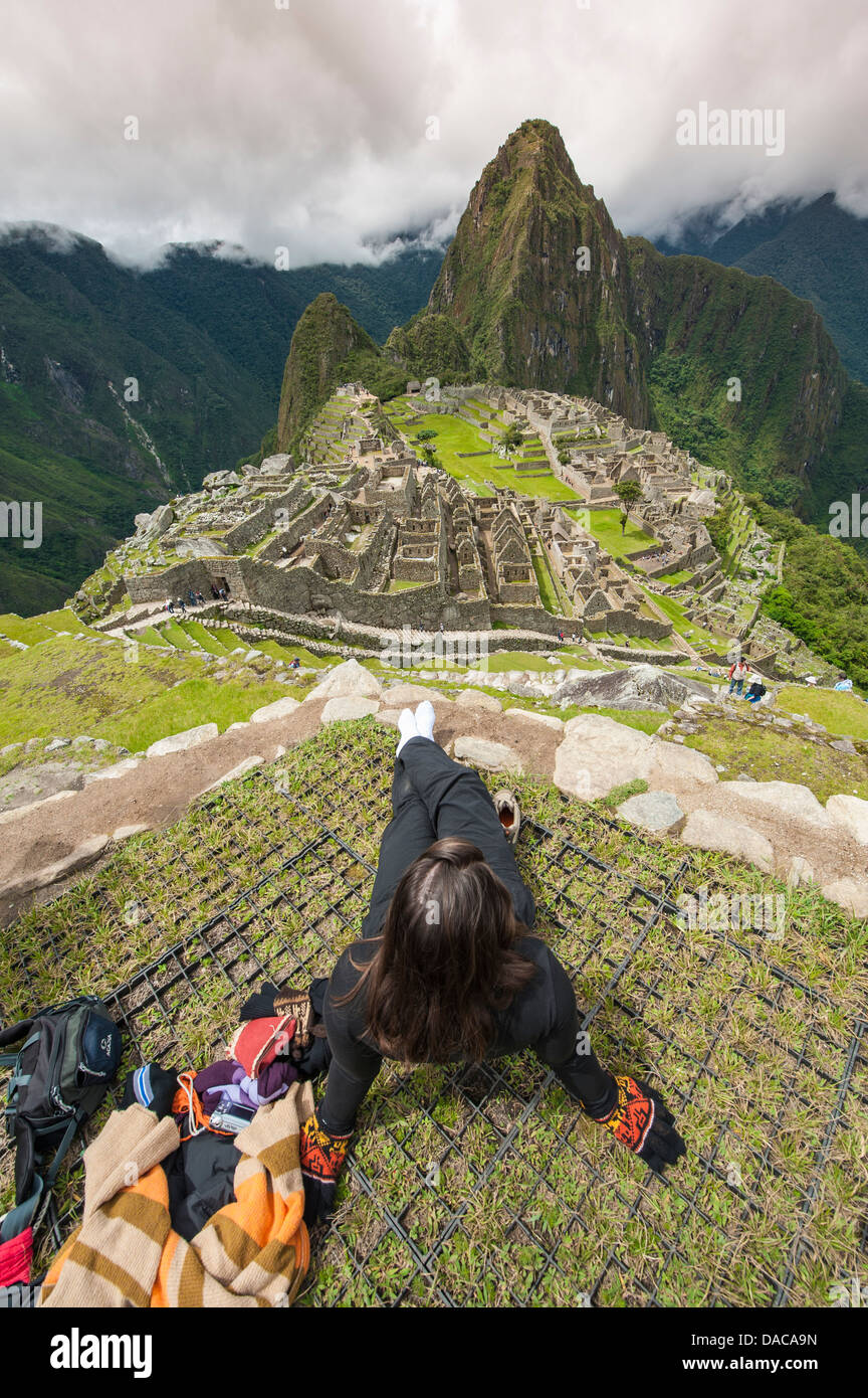 Hikers relaxing at Machu Picchu unesco world heritage site ancient Inca ...