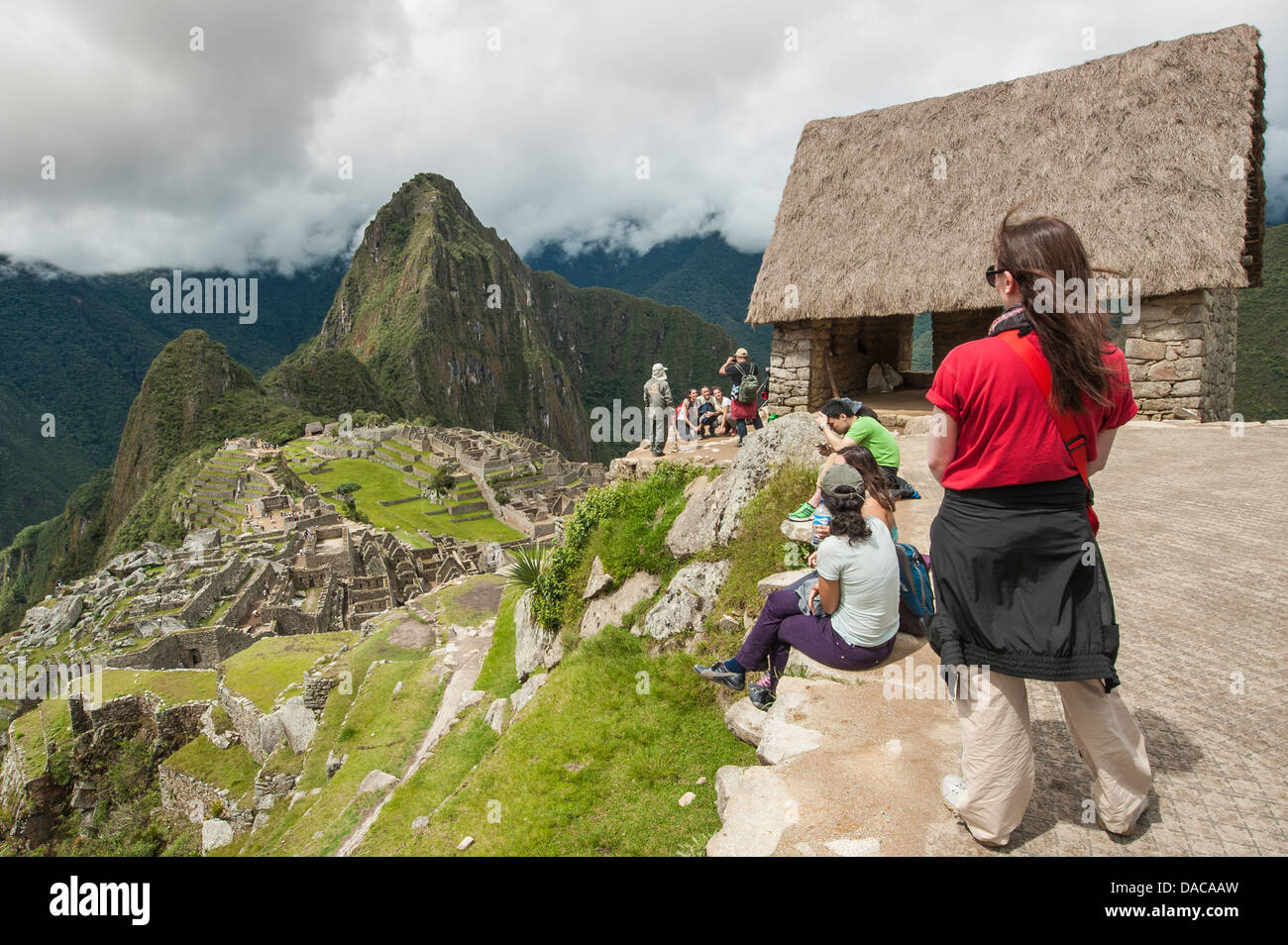 Hikers relaxing at Machu Picchu unesco world heritage site ancient Inca ...