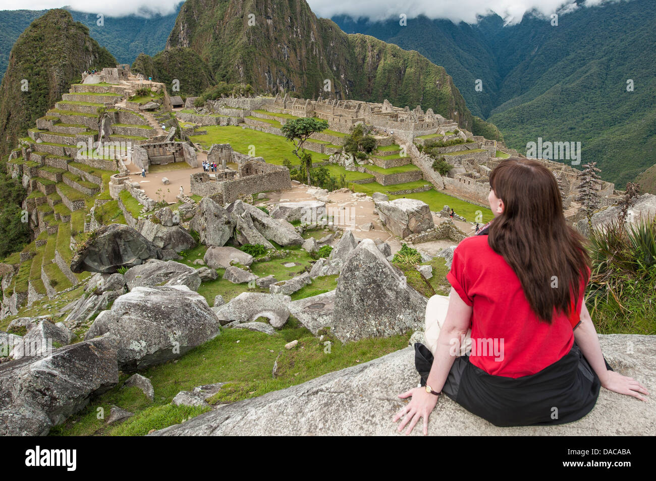 Hikers relaxing at Machu Picchu unesco world heritage site ancient Inca ...