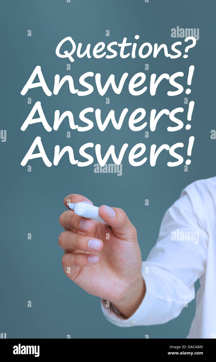 Businessman writing the words questions and answers Stock Photo - Alamy