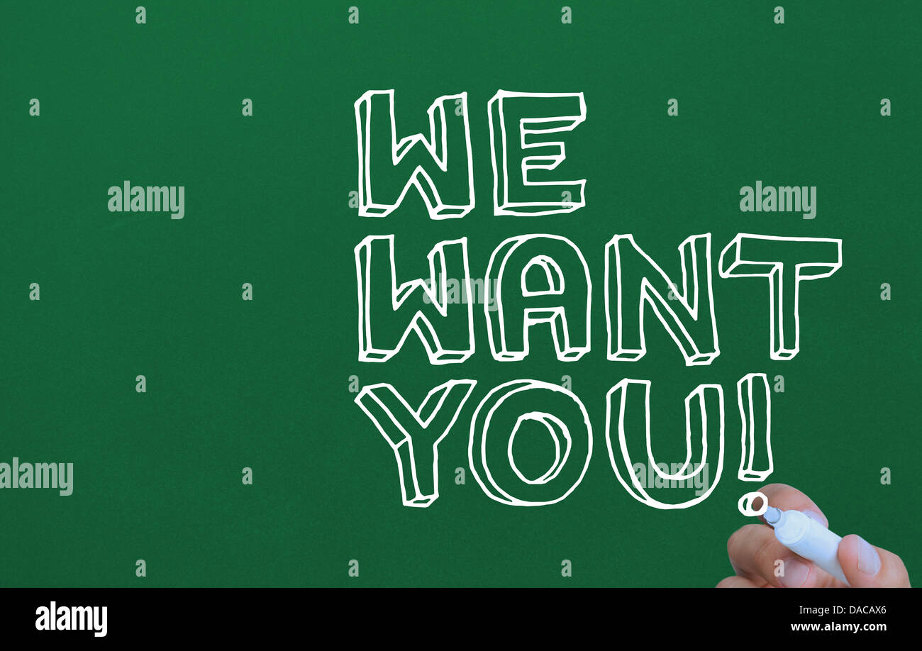 Hand holding a marker and writing we want you Stock Photo - Alamy