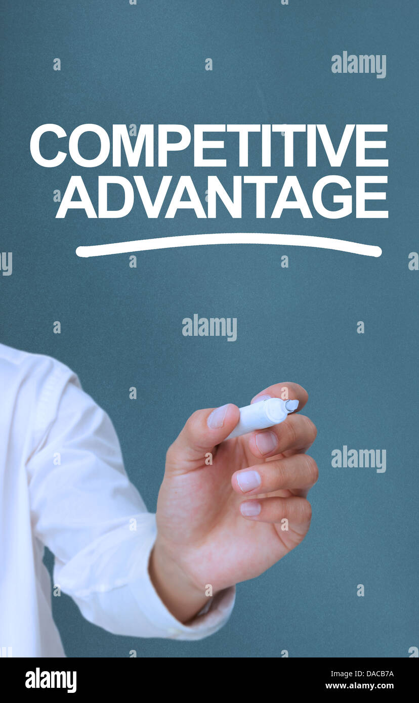 Businessman writing competitive advantage Stock Photo - Alamy