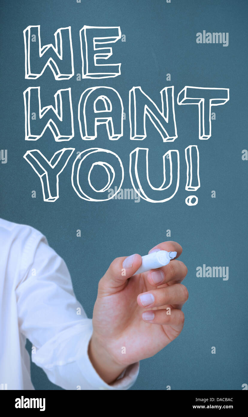 Businessman holding a marker and writing we want you Stock Photo - Alamy
