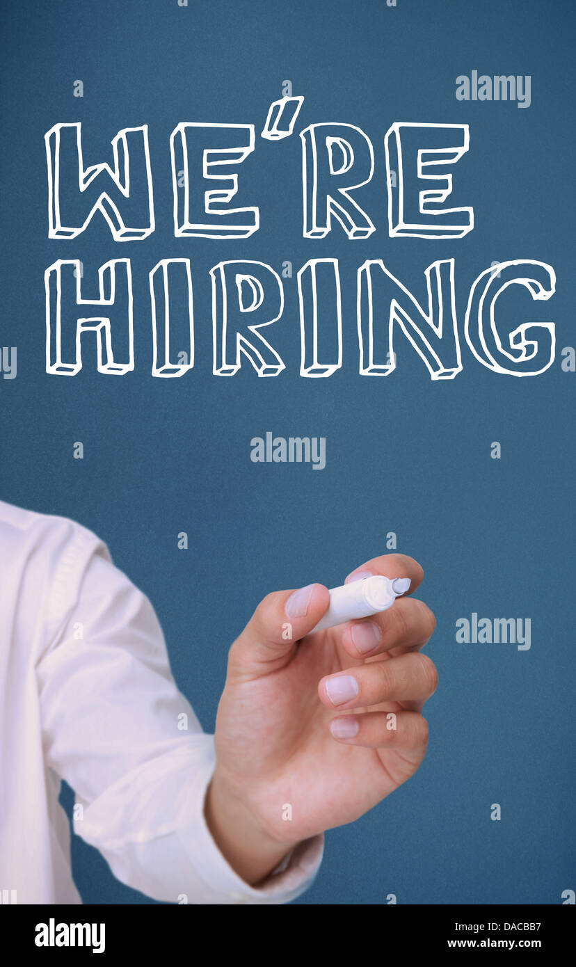 Hand holding a marker and writing were hiring Stock Photo - Alamy