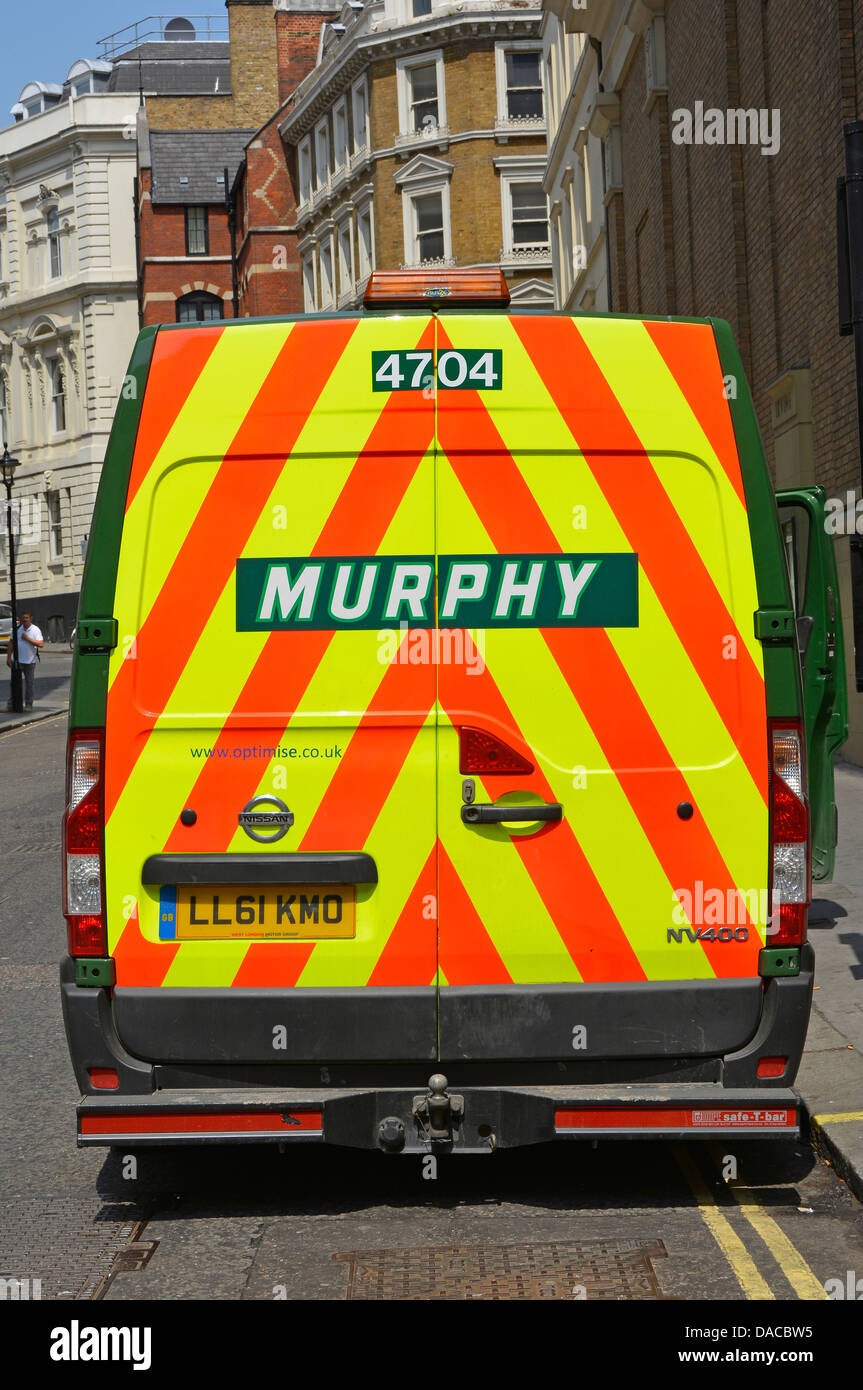 Conspicuous high visibility Murphy contractors van red yellow ...