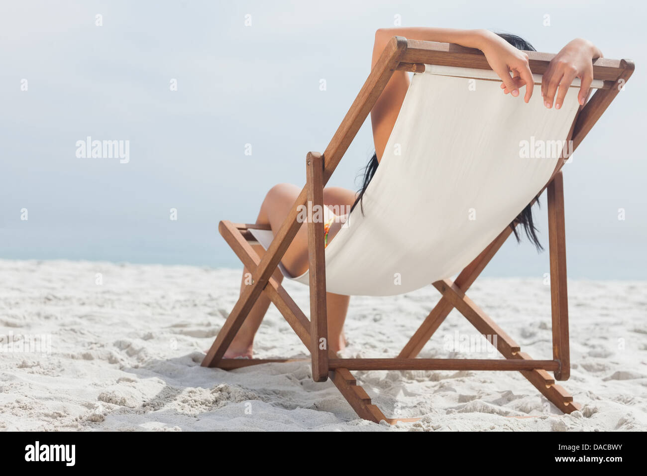 Woman lying on her deck chair Stock Photo - Alamy