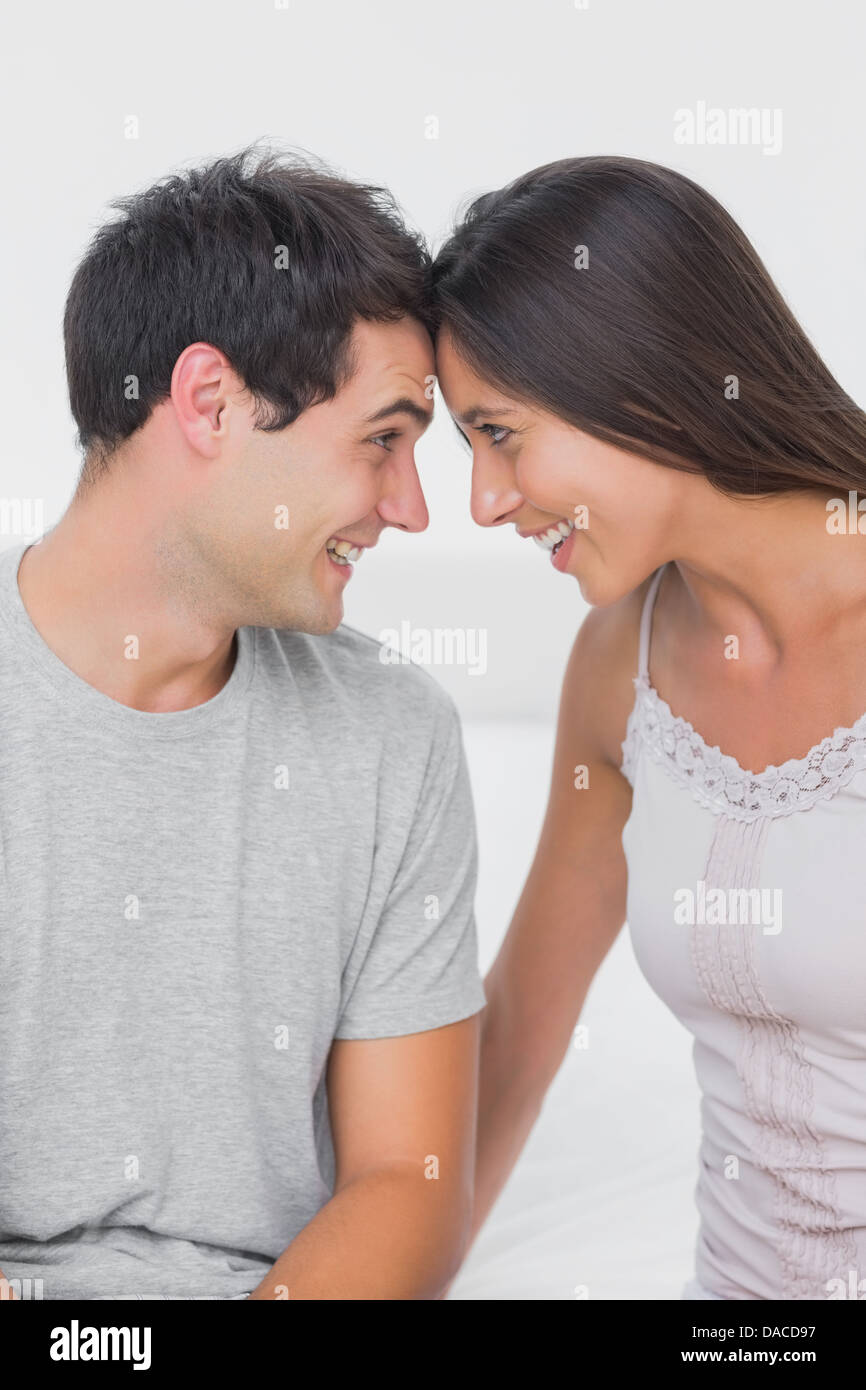 Cheerful couple facing each other Stock Photo - Alamy