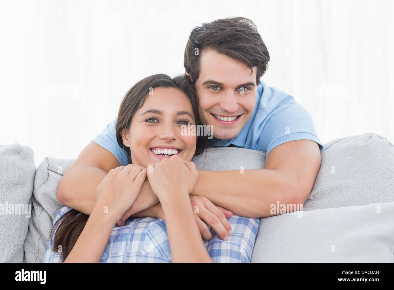 Man embracing his partner Stock Photo - Alamy