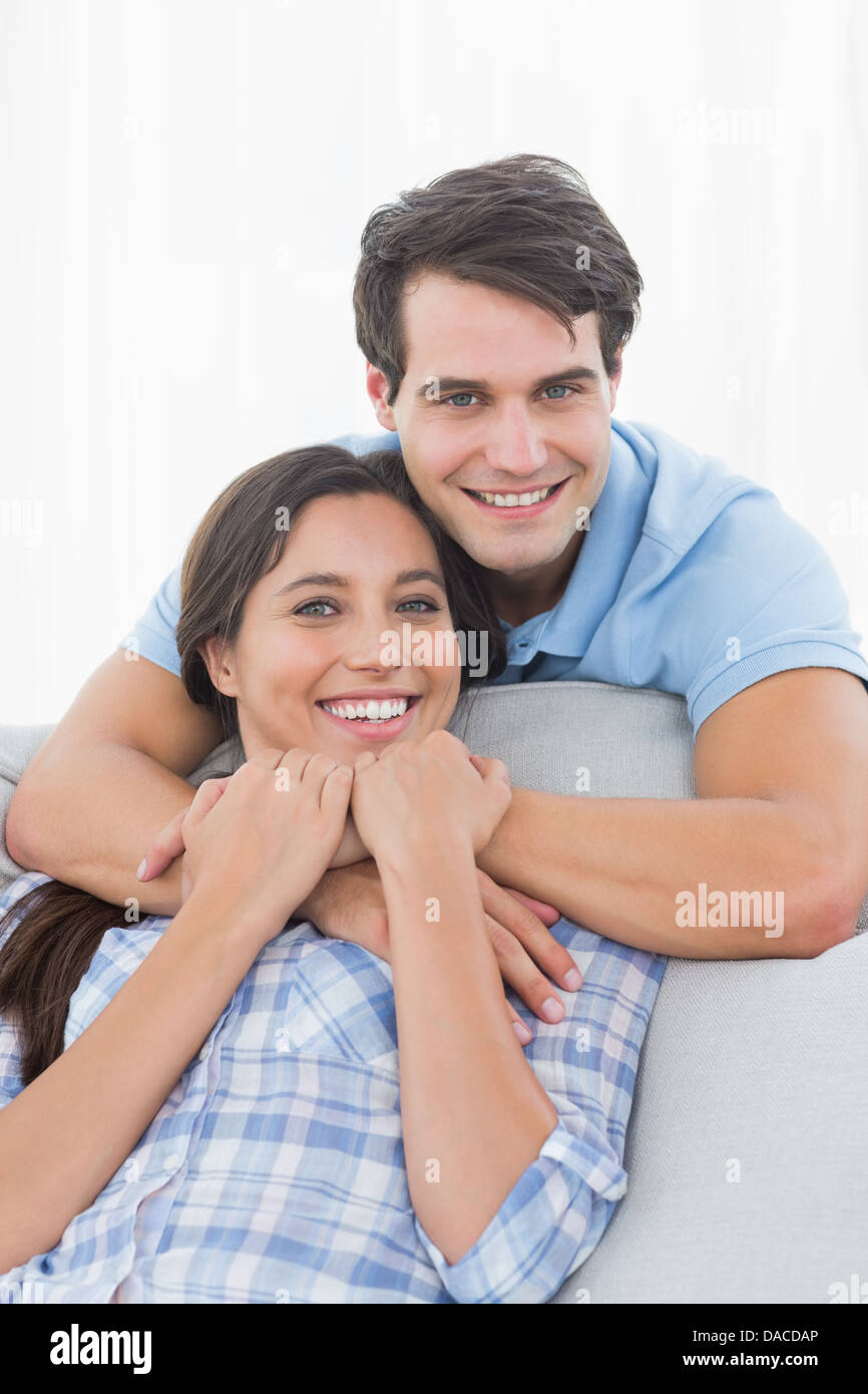 Portrait of a man embracing his partner Stock Photo - Alamy