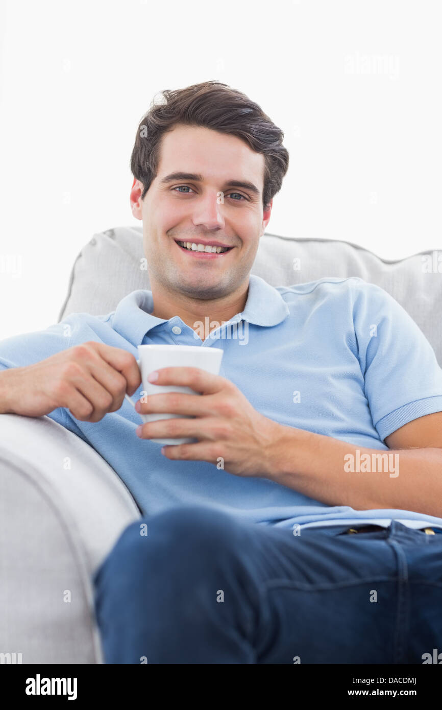 Portrait of a smiling man holding a cup of coffee Stock Photo - Alamy