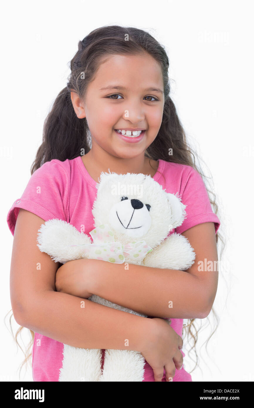 Cute little girl holding her teddy bear Stock Photo - Alamy