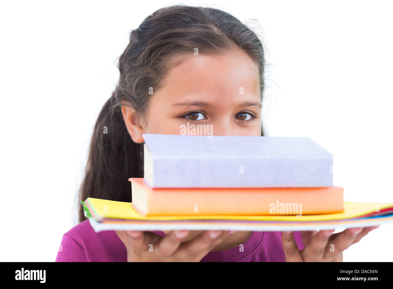 Little girl holding her homework and looking at camera Stock Photo - Alamy