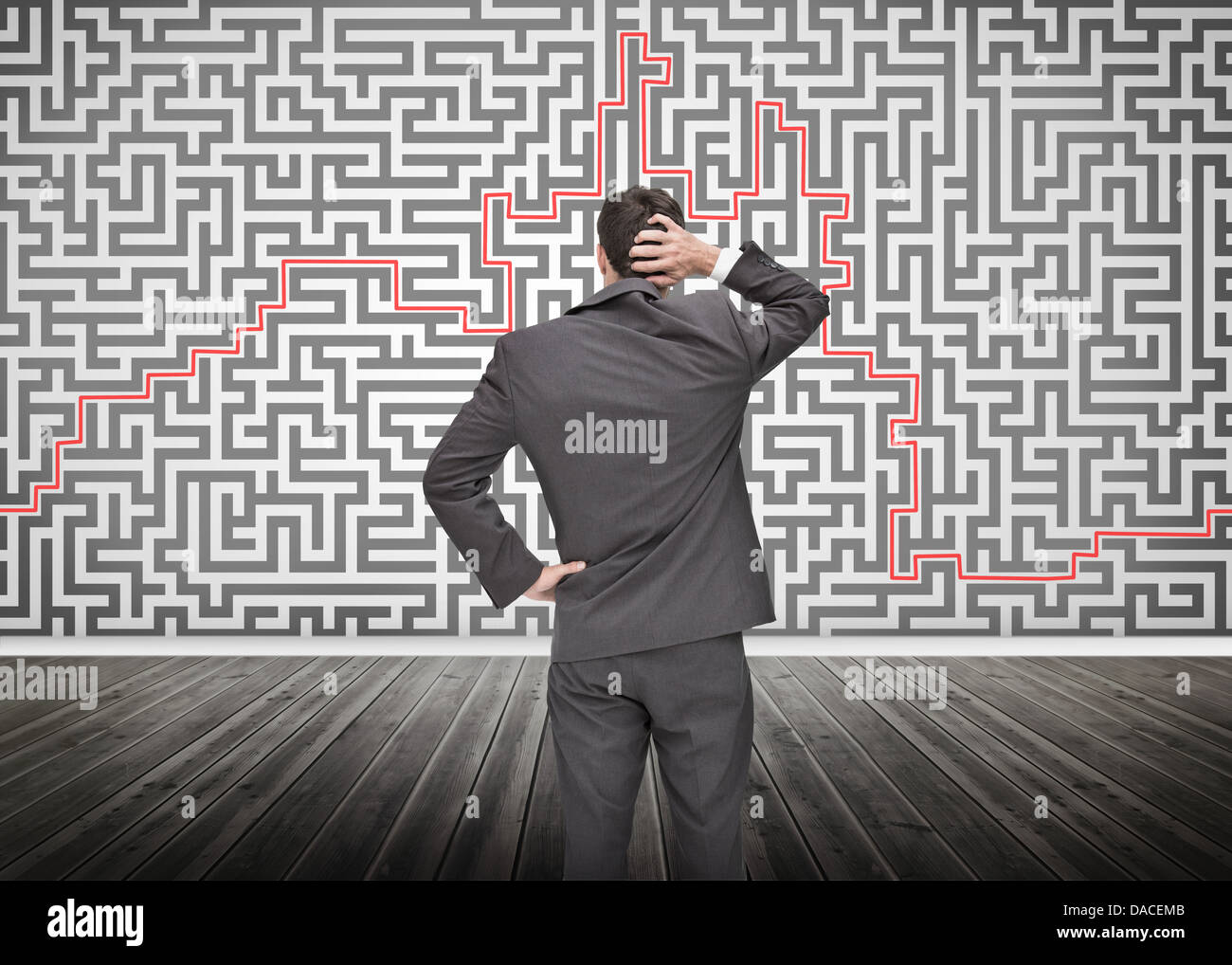 Puzzled businessman looking at a maze Stock Photo - Alamy